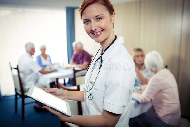 Portrait of a Nurse with Tablet Computer Stock Image - Image of care ...