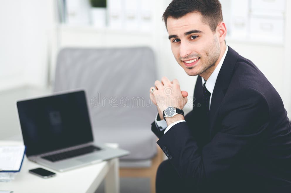 Portrait of Office Worker Man Sitting at Office Desk Using Laptop ...