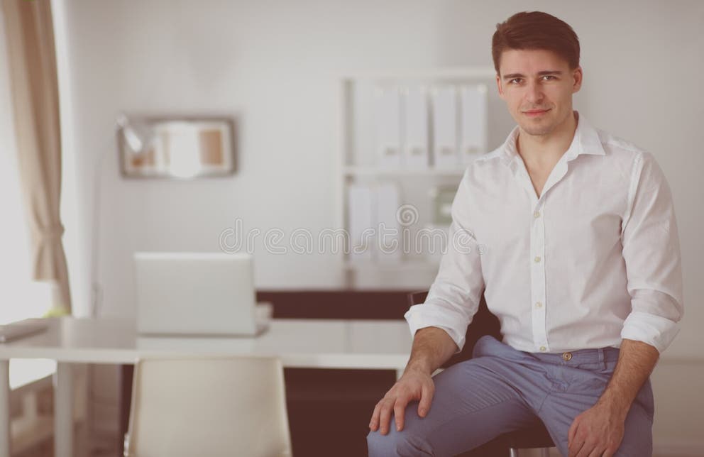Portrait of Office Worker Man Sitting at Office Desk Using Laptop ...