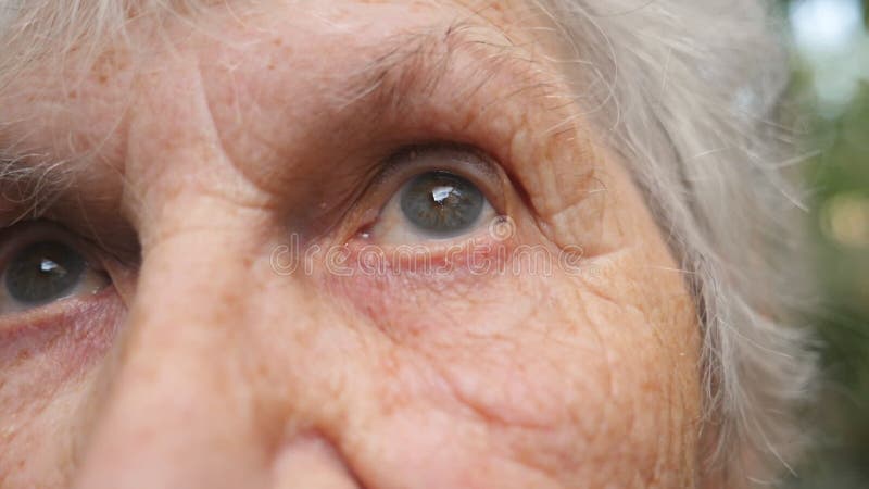 Portrait Of Old Grandmother Looking Up Close Up Eyes Of An Elderly