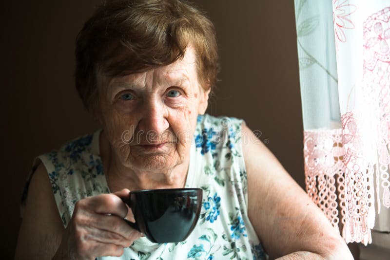Portrait of an Old Woman Drinking Tea at Home. Stock Photo - Image of ...