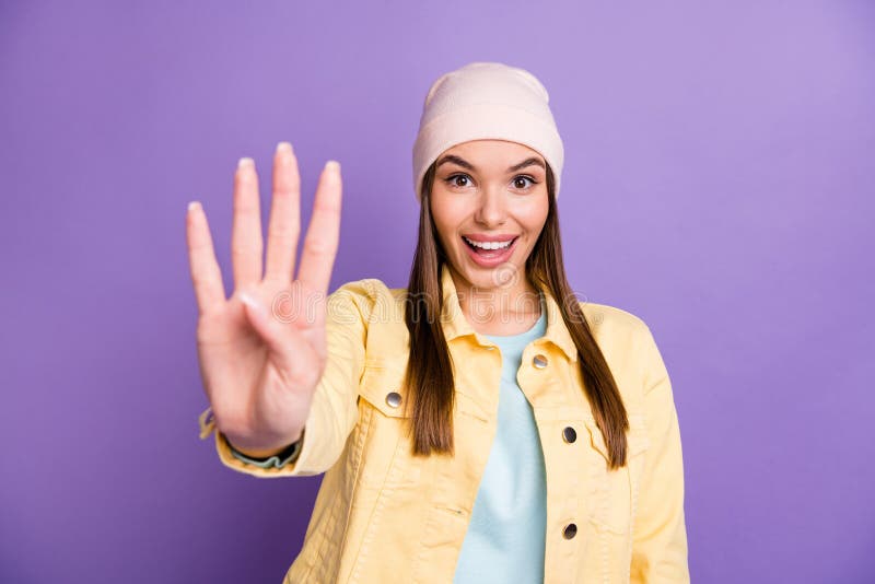 Portrait Of Optimistic Straight Hairdo Girl Show Four Fingers Wear Cap