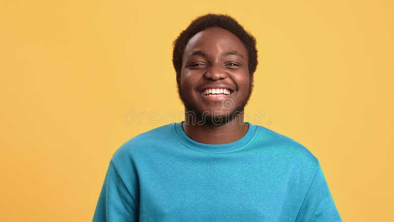 Portrait Overjoyed African American Young Guy Laughing With Positive