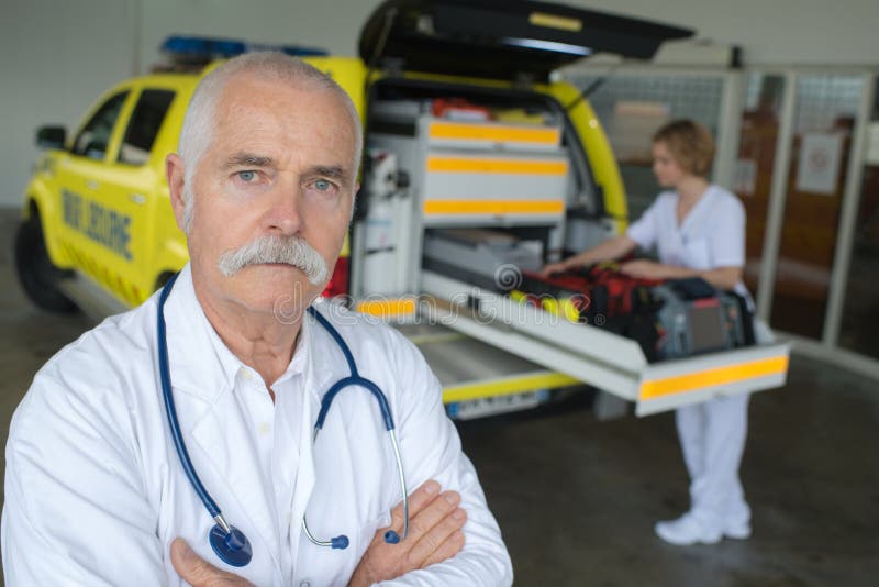 Portrait of Paramedic in Front of Ambulance Stock Image - Image of ...