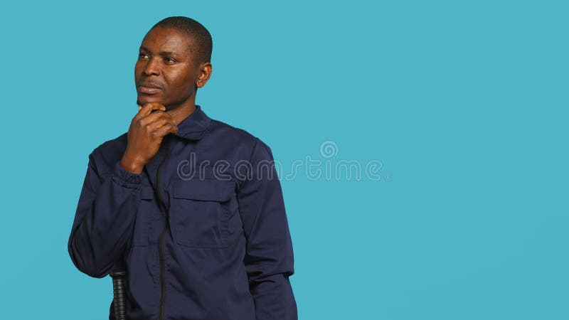 Portrait of Pensive Bodyguard Rubbing Chin, Doing Thinking Hand Gesture ...