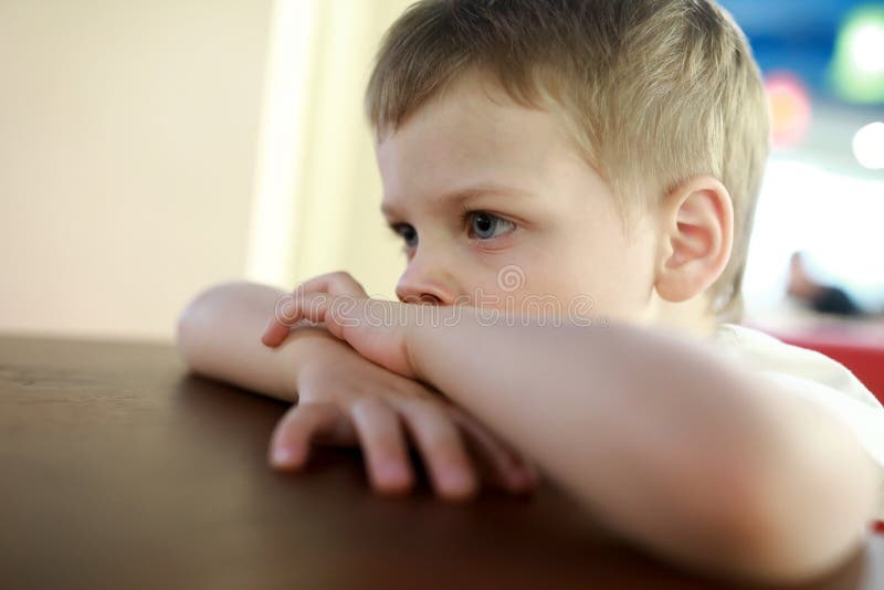 Pensive child in cafe stock photo. Image of handsome - 118092632