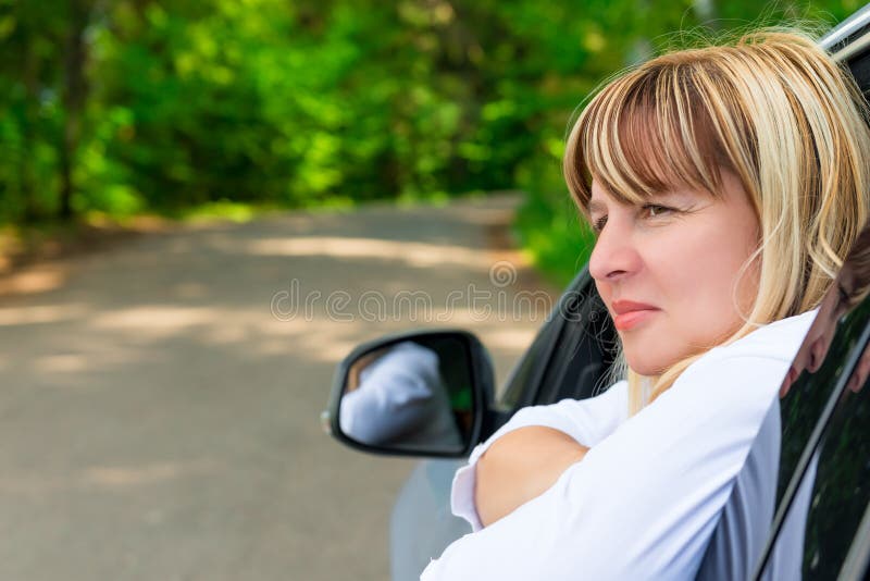 Portrait of a Pensive Female Driver 50 Years Stock Photo - Image of ...