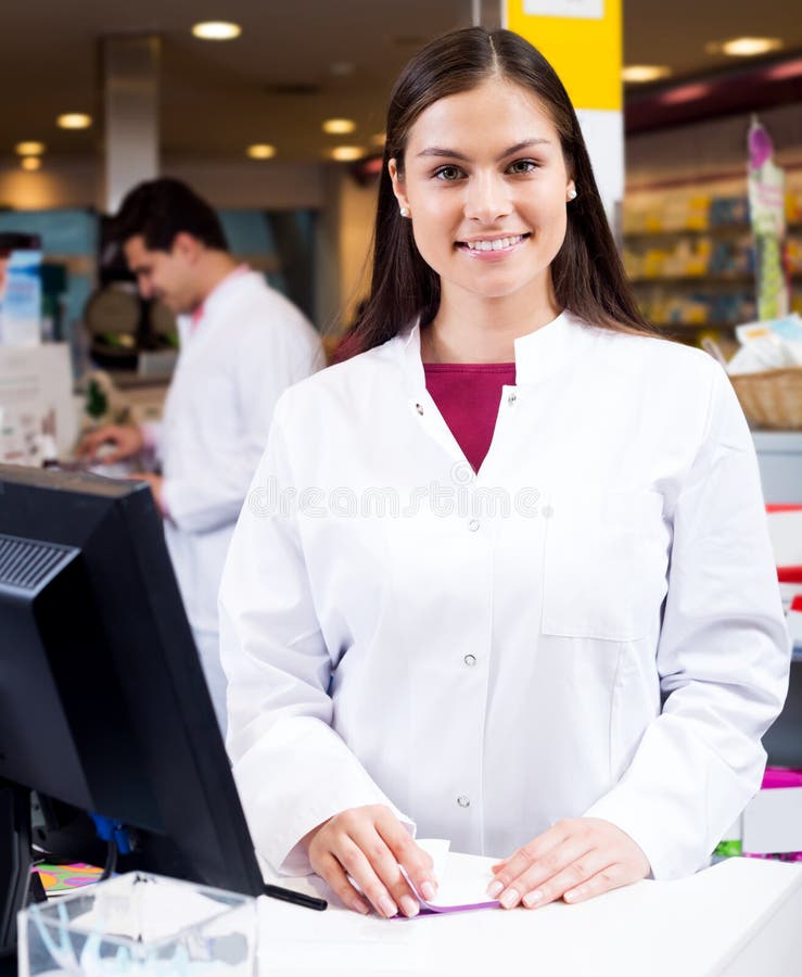 Pharmacist with Assistant in Pharmacy Stock Image - Image of cashpoint ...