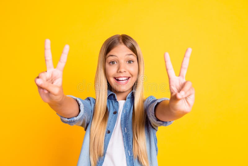 Portrait Photo Of Girl With Long Blonde Hair Smiling Showing V Sign