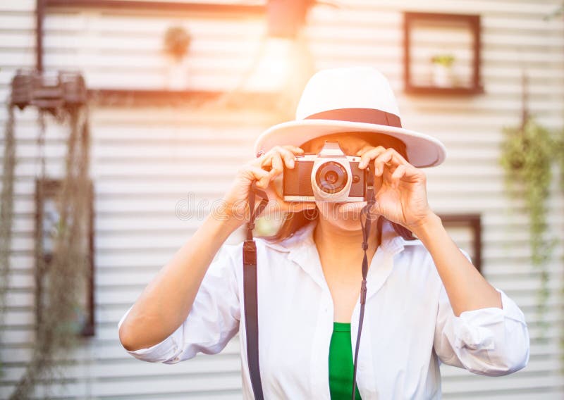 Portrait Of A Photographer Covering Her Face With Camera. Stock Photo ...