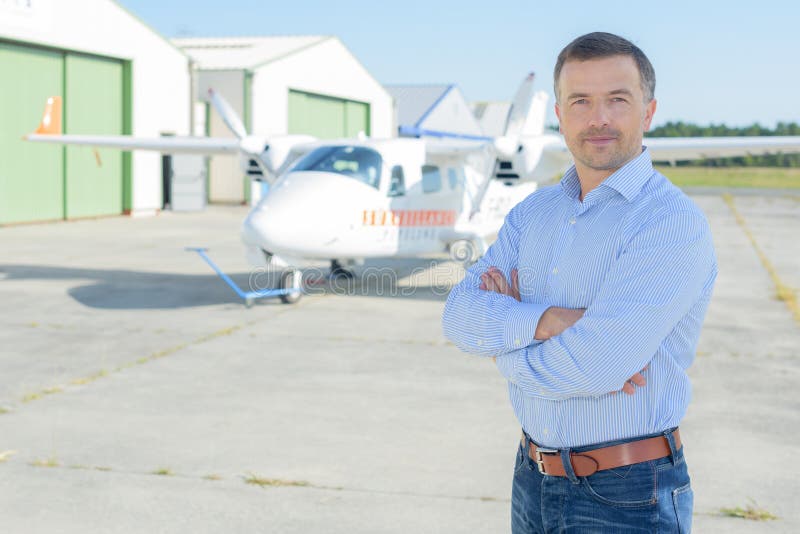 Portrait pilot with plane stock photo. Image of looking - 338944622