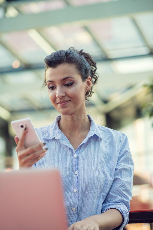 Portrait Of A Playful Young Girl Taking Selfie With Mobile Phone While