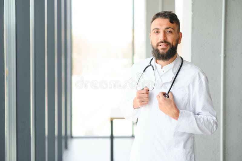 Portrait of Pleasant Young Arabian Doctor in White Coat. Stock Image ...