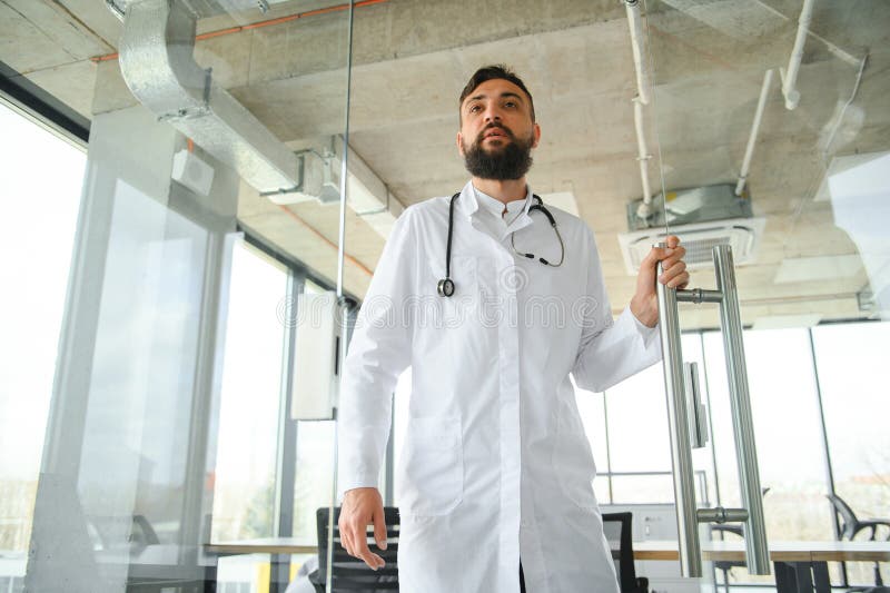 Portrait of Pleasant Young Arabian Doctor in White Coat. Stock Image ...