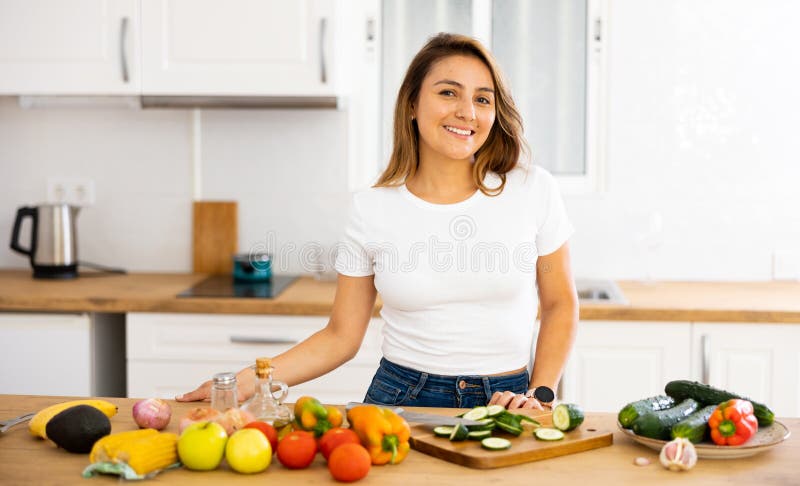 Portrait of Pleased Housewife Preparing Salad in Kitchen Stock Photo ... Portrait of Pleased Housewife Preparing Salad in Kitchen Stock Photo ...