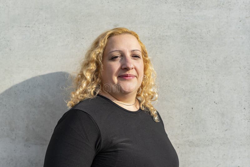 Portrait of a Plus-size Woman Looking at Camera Outdoors Stock Photo ...