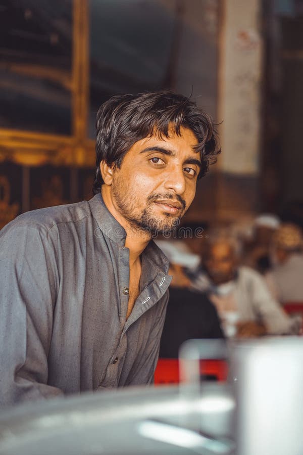 Portrait of a Poor Middle Aged Pakistani Man, Working in His Shop Stock ...