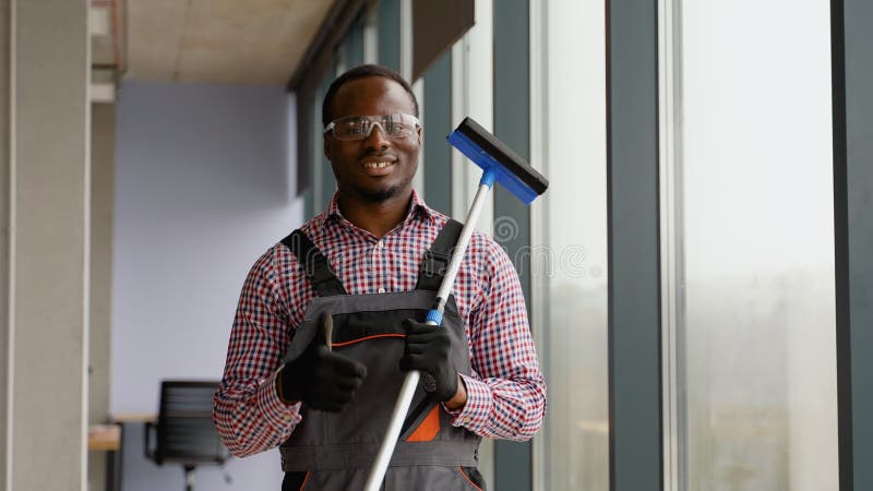 Portrait of Positive Black Window Washer in Office Stock Video - Video ...