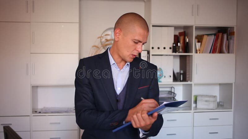 Portrait of Positive Business Man with Folder of Documents at Office ...