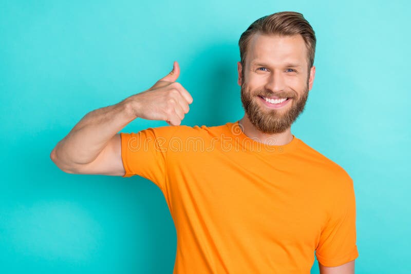 Portrait Of Positive Cheerful Nice Guy With Blond Beard Wear Orange T