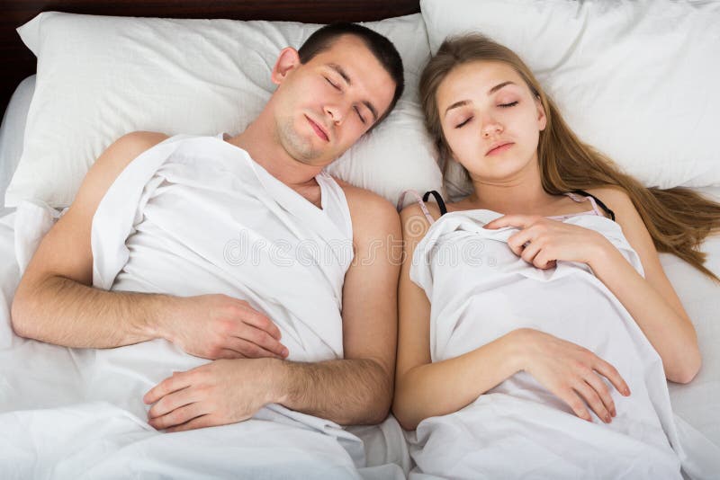 Portrait of Positive Couple Napping in Bed Stock Photo - Image of ...