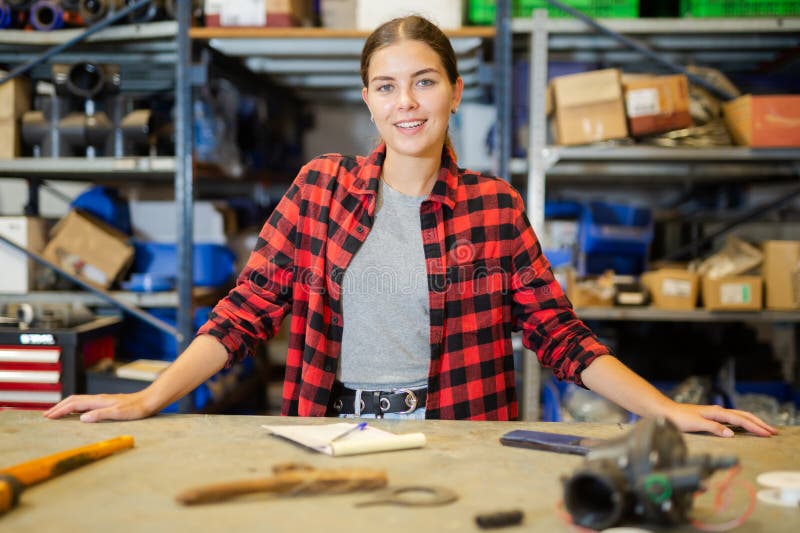Portrait of an Positive Female Worker in Store Warehouse Stock Photo ...