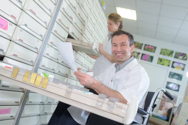 Portrait Positive Friendly Pharmacist Working in Modern Farmacy Stock ...