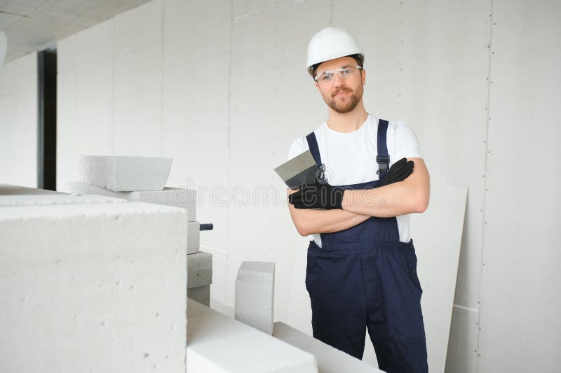 Portrait of Positive, Handsome Young Male Builder in Hard Hat. Stock ...
