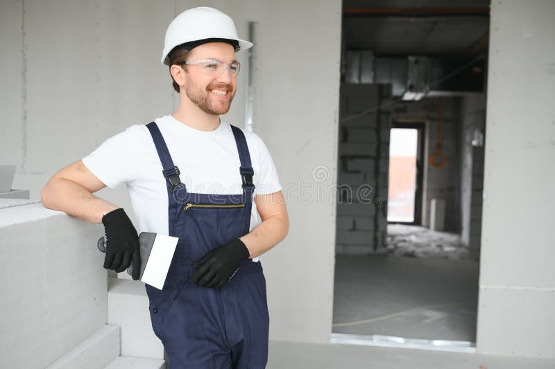 Portrait of Positive, Handsome Young Male Builder in Hard Hat. Stock ...