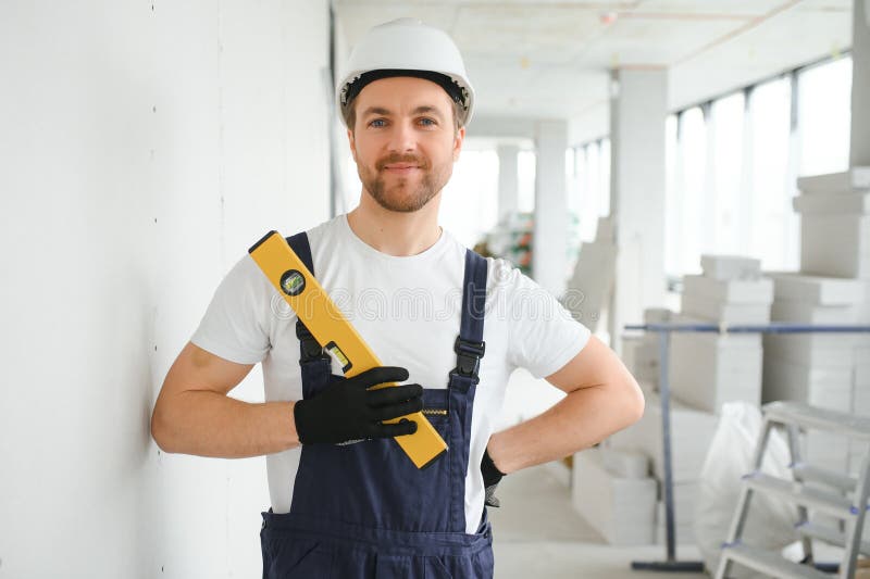 Portrait of Positive, Handsome Young Male Builder in Hard Hat. Stock ...