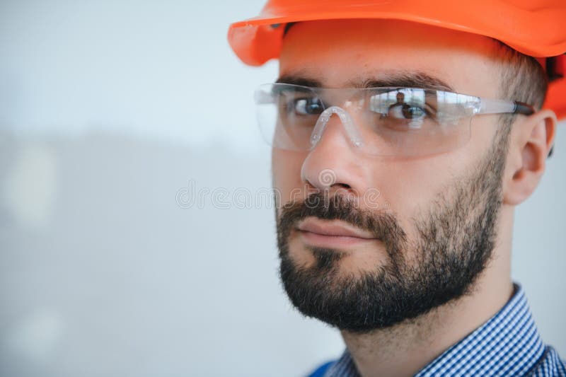Portrait of Positive, Handsome Young Male Builder in Hard Hat while ...