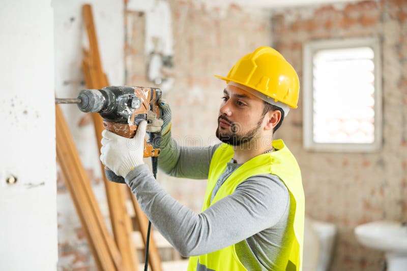 Confident Builder Posing on Indoor Construction Site Stock Photo ...