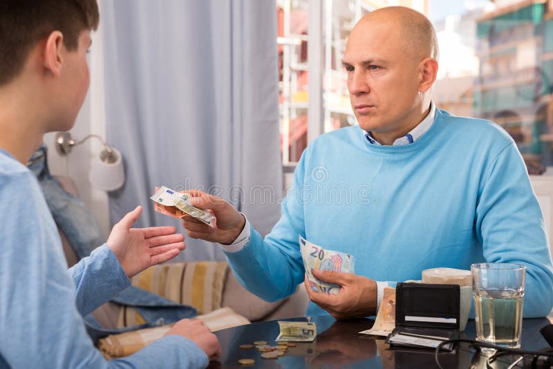 Mom Giving Money and Instructions To Son Stock Photo - Image of charges ... Mom Giving Money and Instructions To Son Stock Photo - Image of charges ...