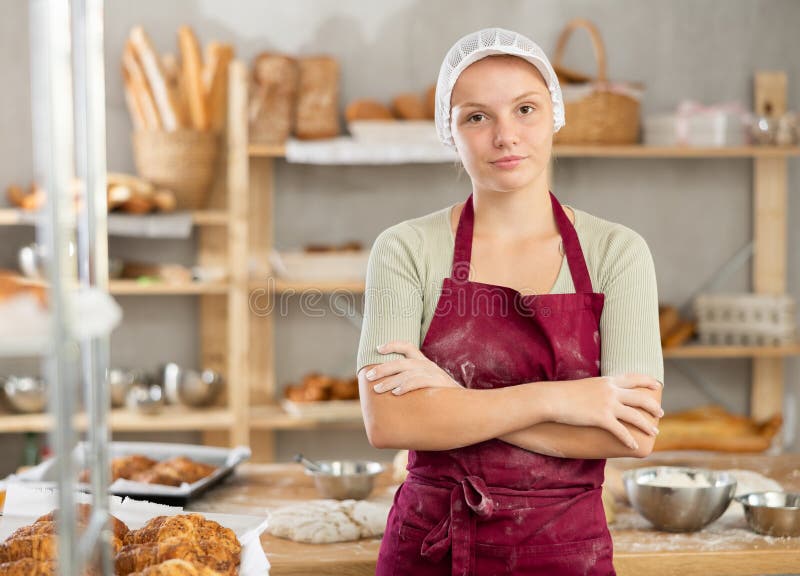 Portrait of a Positive Young Girl Baker in the Kitchen of Bakery Stock ...