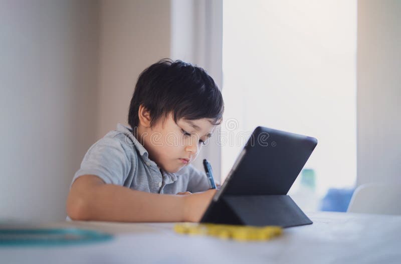 Portrait of Preschool Kid Using Tablet for His Homework, Child Doing ...