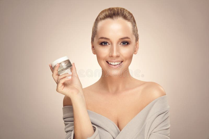 Young Caucasian Woman After Shower In Spa Bathrobe Presenting Face