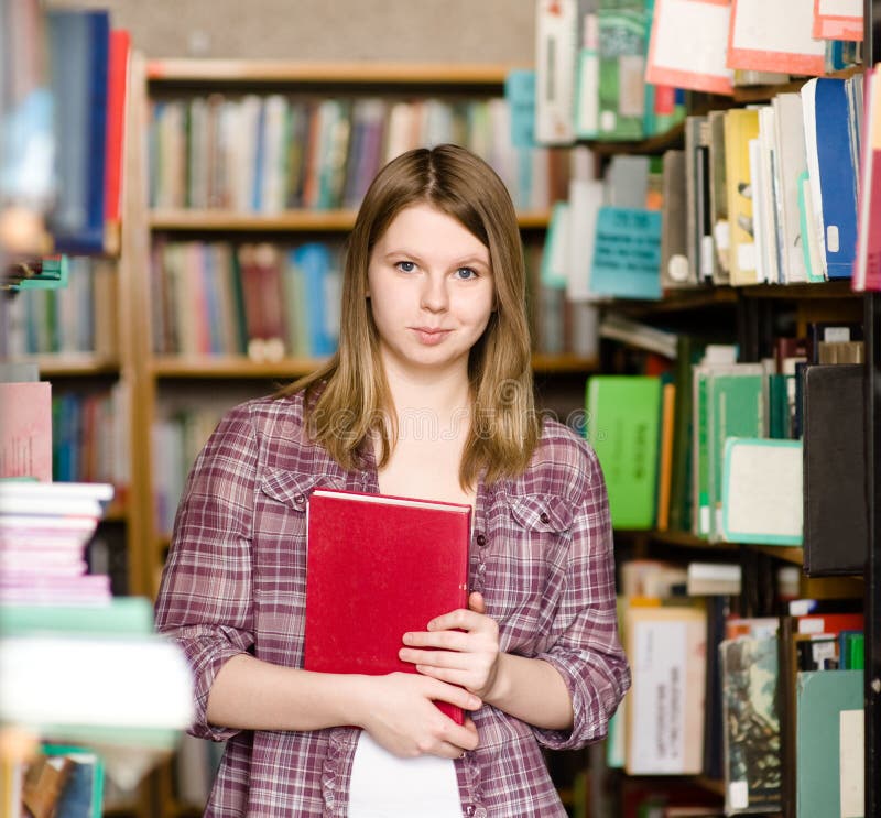Girl Reading a Book at the Library Stock Image - Image of caucasian ...