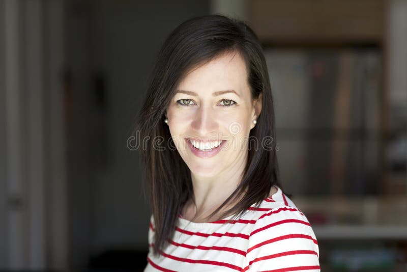 Portrait of a Pretty Mature Woman Smiling at Home. Stock Image - Image ... Portrait of a Pretty Mature Woman Smiling at Home. Stock Image - Image ...