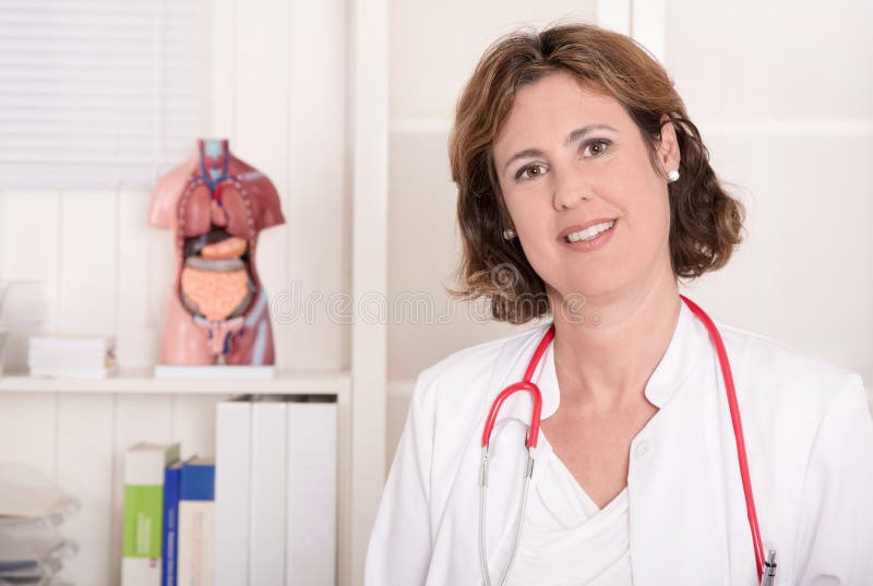 Portrait of Pretty Smiling Physician with Stethoscope. Stock Image ...