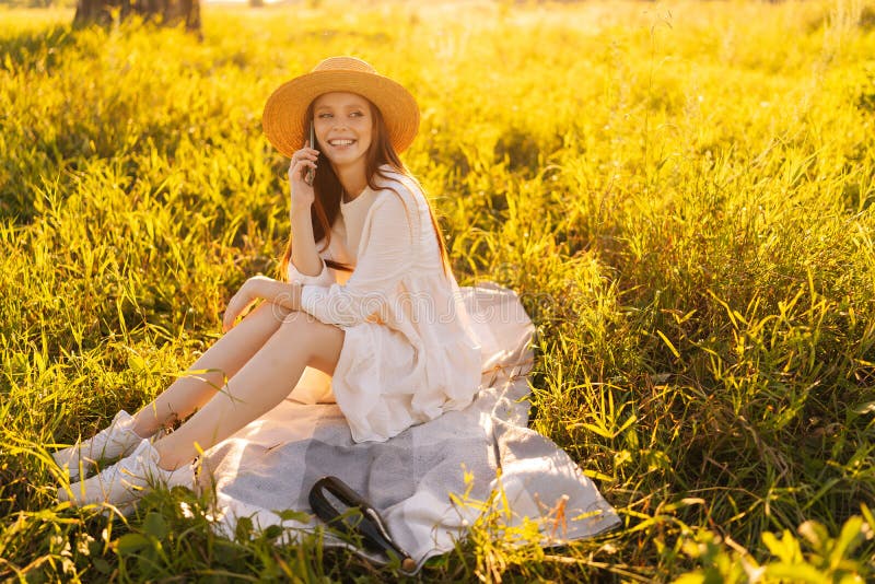 Portrait Of Pretty Smiling Redhead Young Woman Wearing Straw Hat And