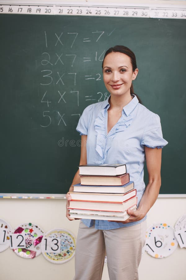 Prepared For An Exciting Lesson Portrait Of A Pretty Teacher Carrying