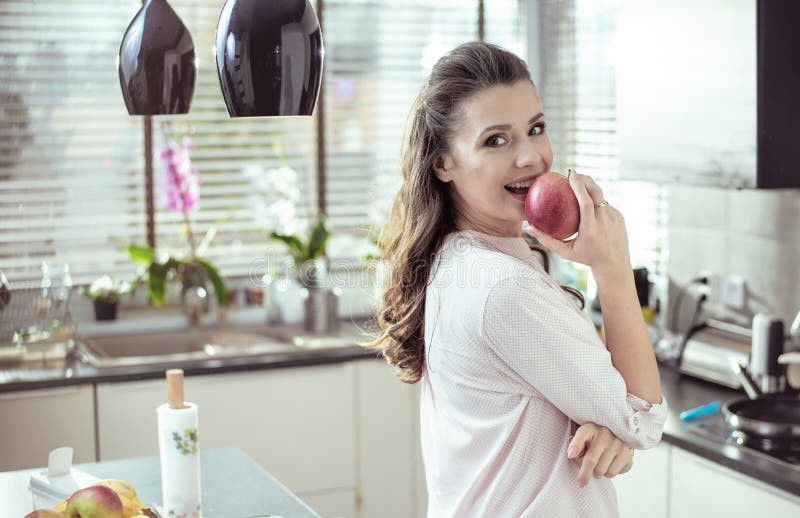 Portrait of a Pretty Lady Biting an Apple Stock Photo - Image of ...