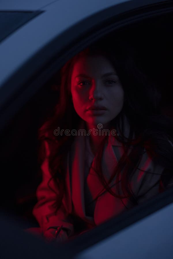 Portrait of Pretty Woman in a Car with Red Light Stock Image - Image of ...