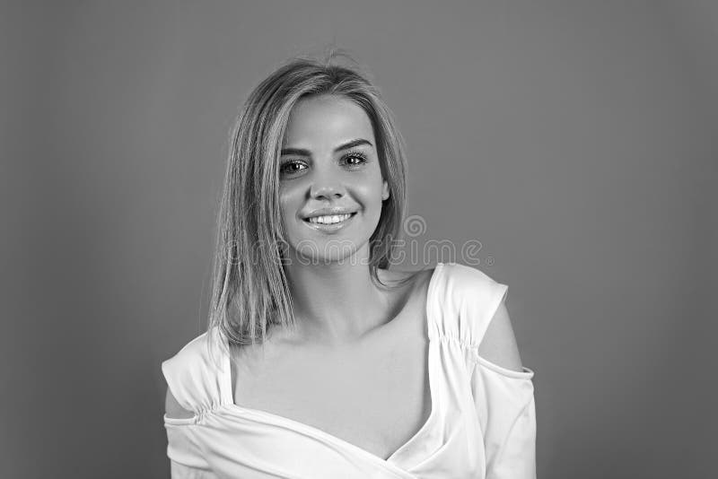Portrait Of Pretty Young Woman In White Dress And Smiling Closeup
