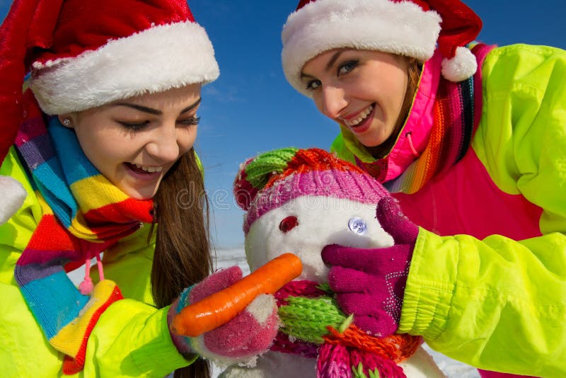 Portrait of a Pretty Young Women with a Snowman Stock Photo - Image of ...