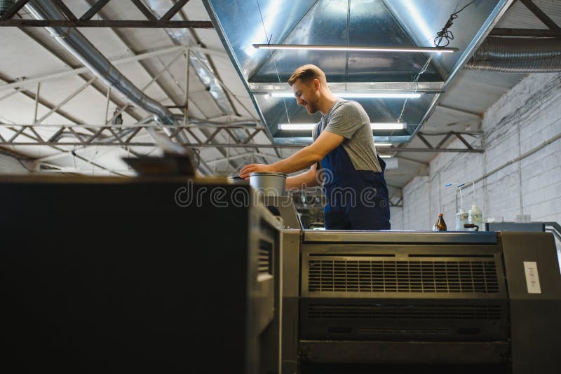 Portrait of Production Line Worker Controlling Manufacturing Process of ...