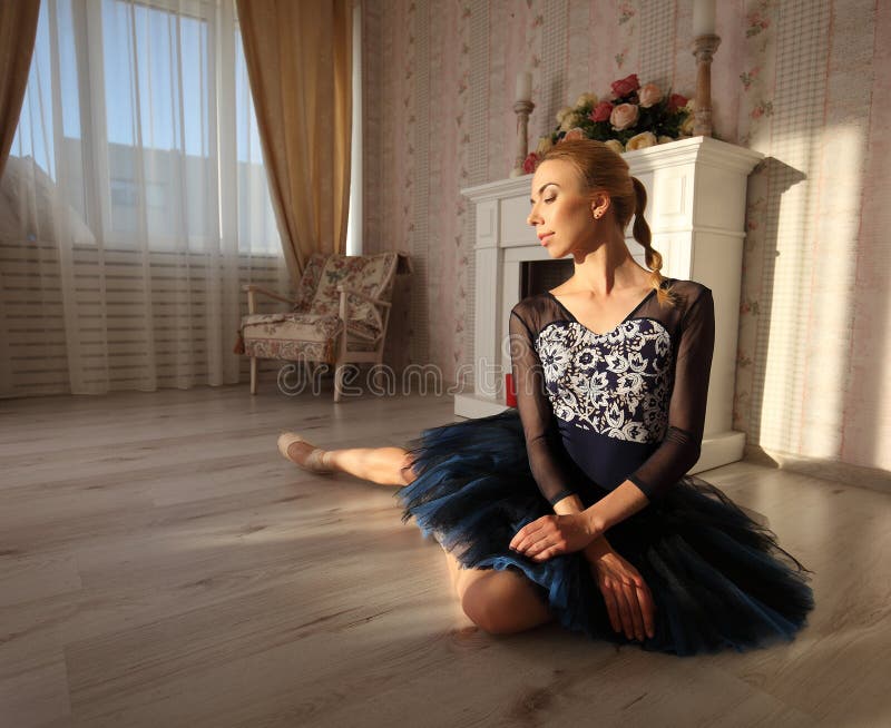 Professional Ballet Dancer Sitting on the Wooden Floor. Female ...