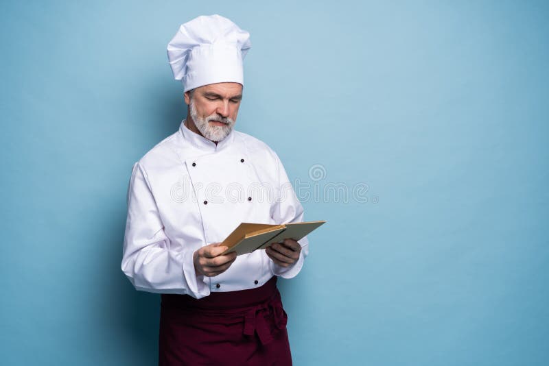 Portrait of a Professional Chef in Uniform Holding Recipe Book and ...