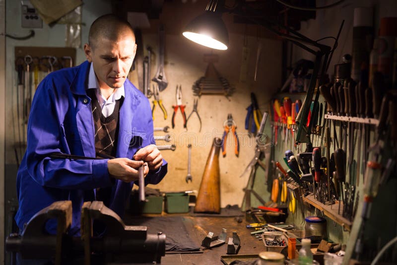 Professional Craftsman Repairing and Assembling Shotgun in Weapons ...