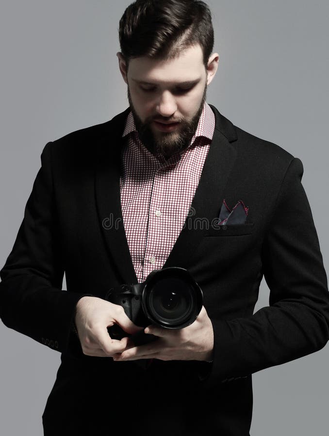 Portrait of a Professional Photographer in a Suit with a Camera Stock ...